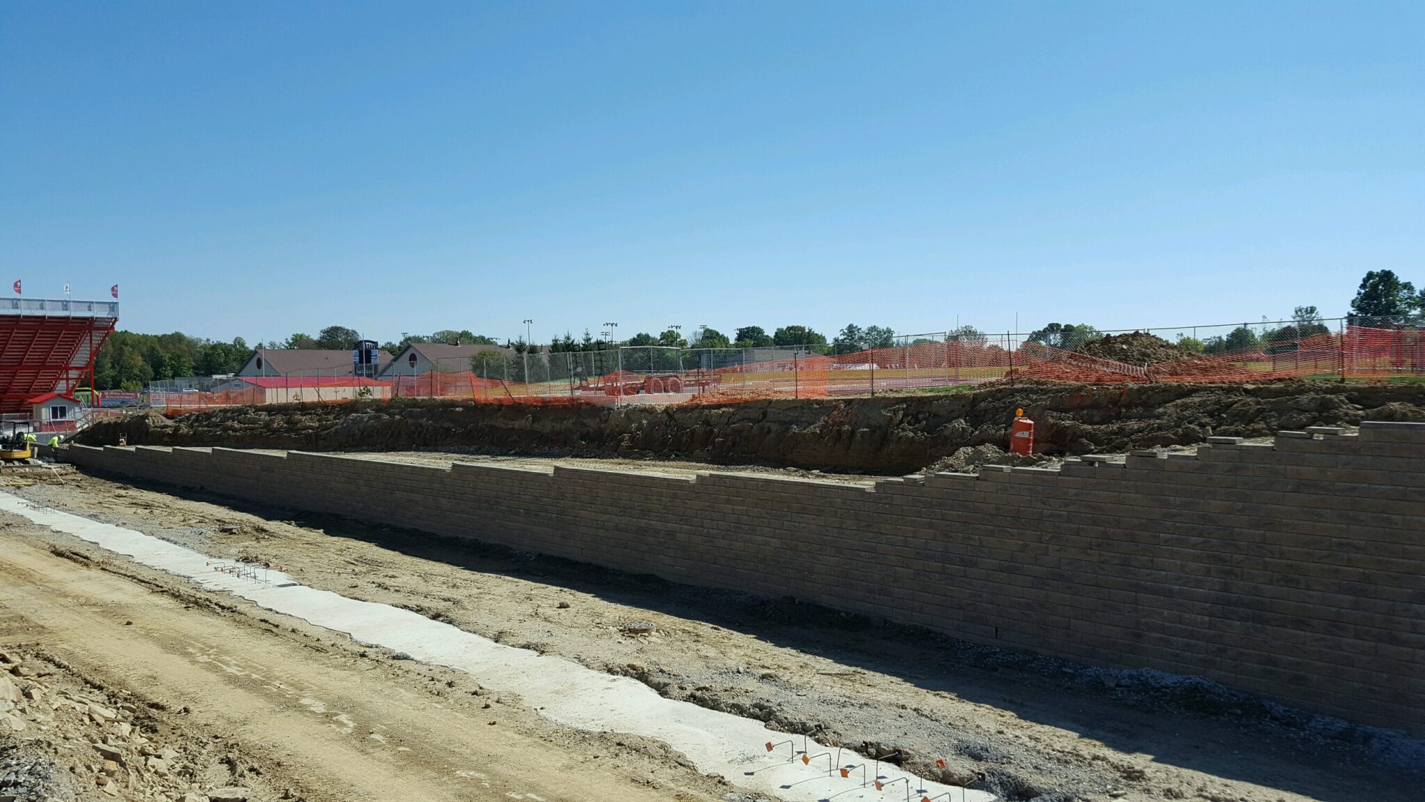 Ruble Outdoor Concepts Builds 16 ft. Tall Engineered Retaining Wall for ...