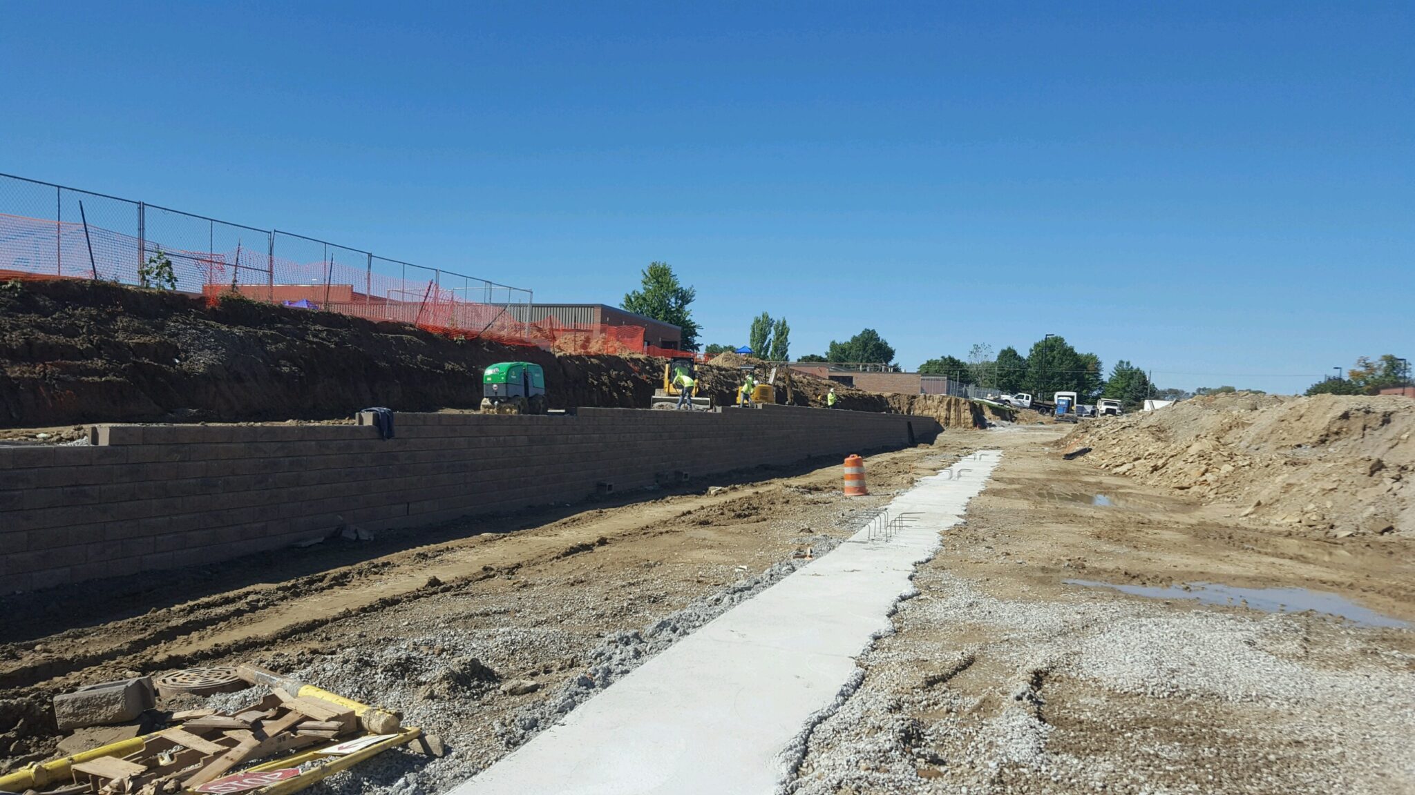 Ruble Outdoor Concepts Builds 16 ft. Tall Engineered Retaining Wall for ...