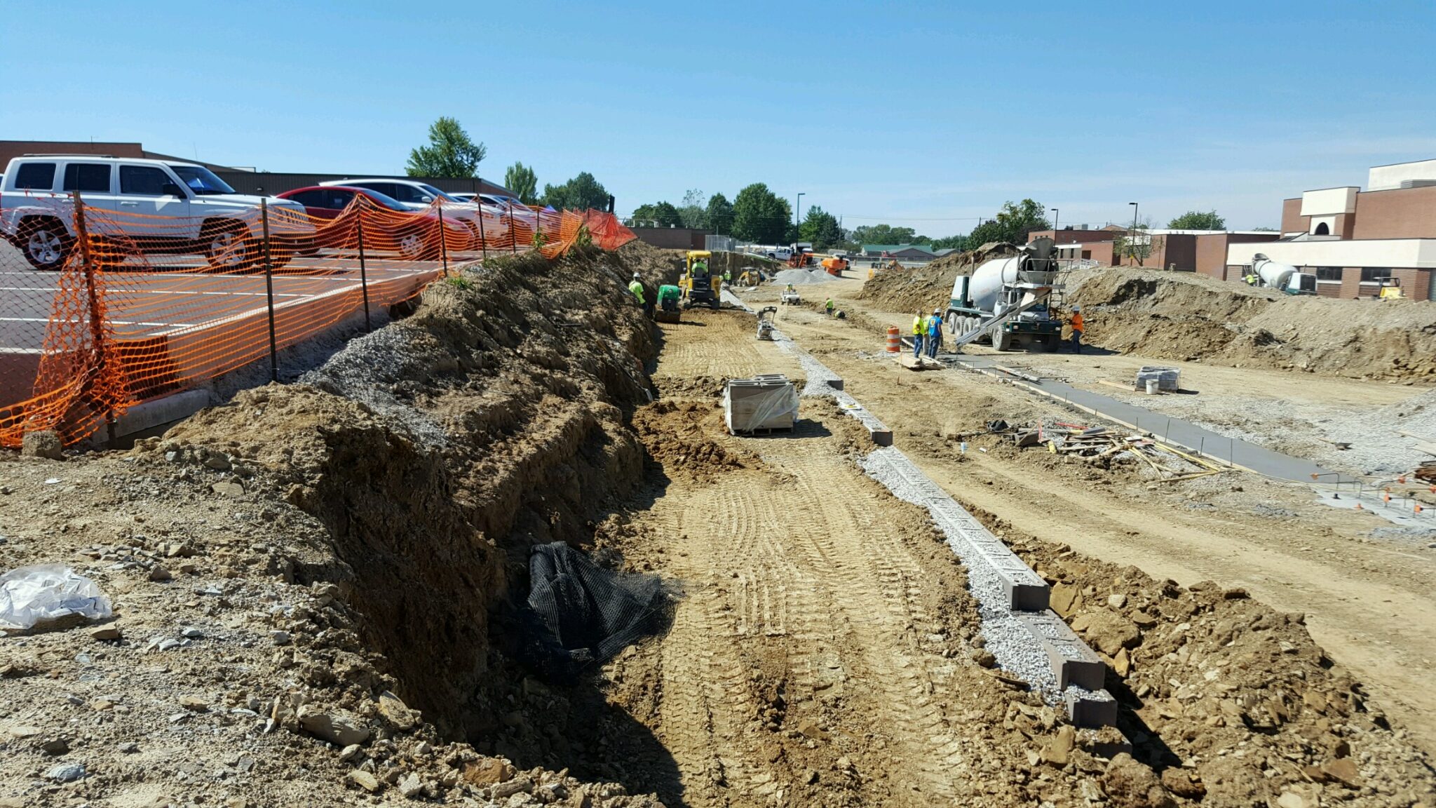 Ruble Outdoor Concepts Builds 16 ft. Tall Engineered Retaining Wall for ...